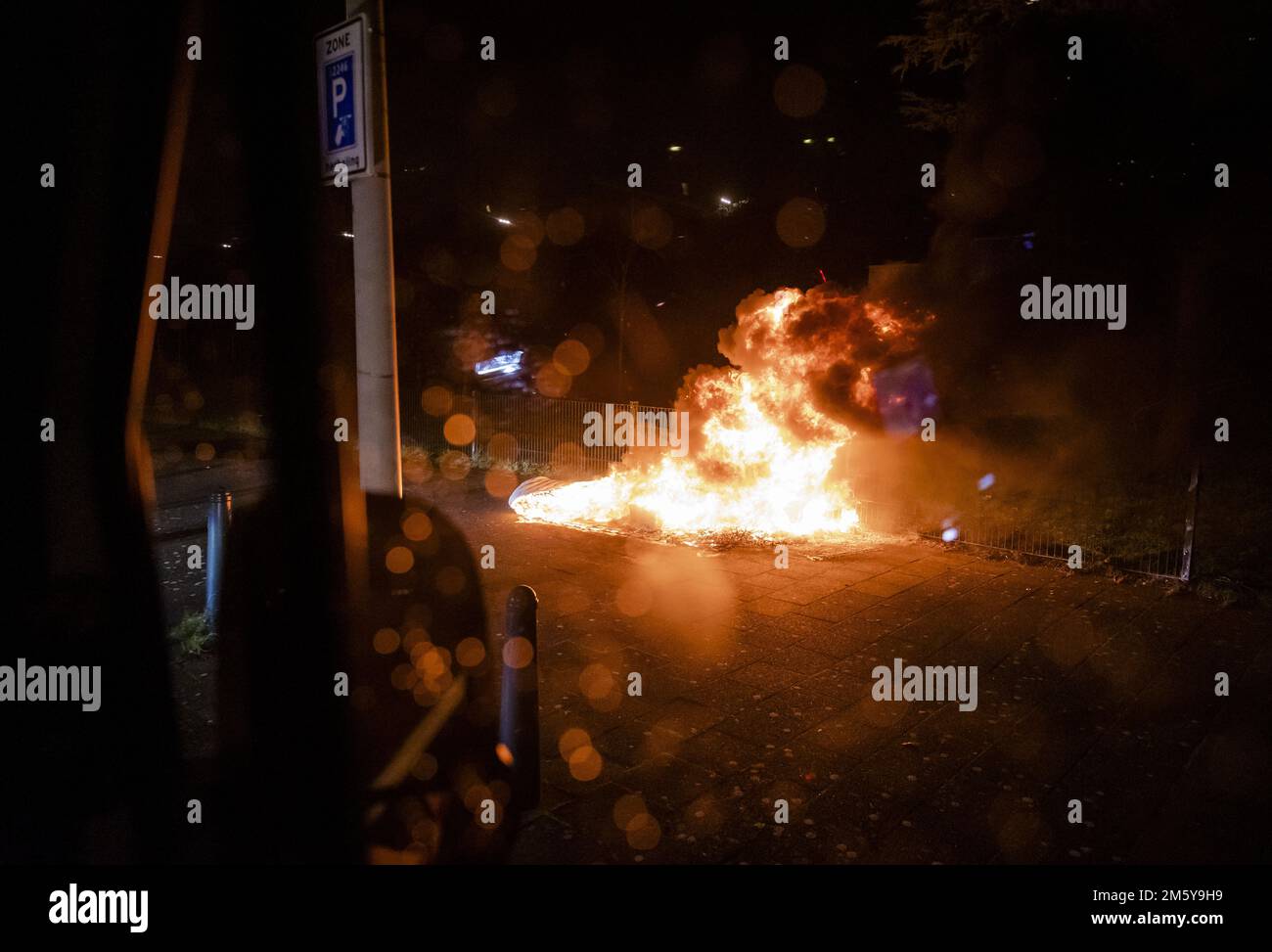 THE HAGUE - A burning mattress seen from a vehicle of the Mobile Unit ...