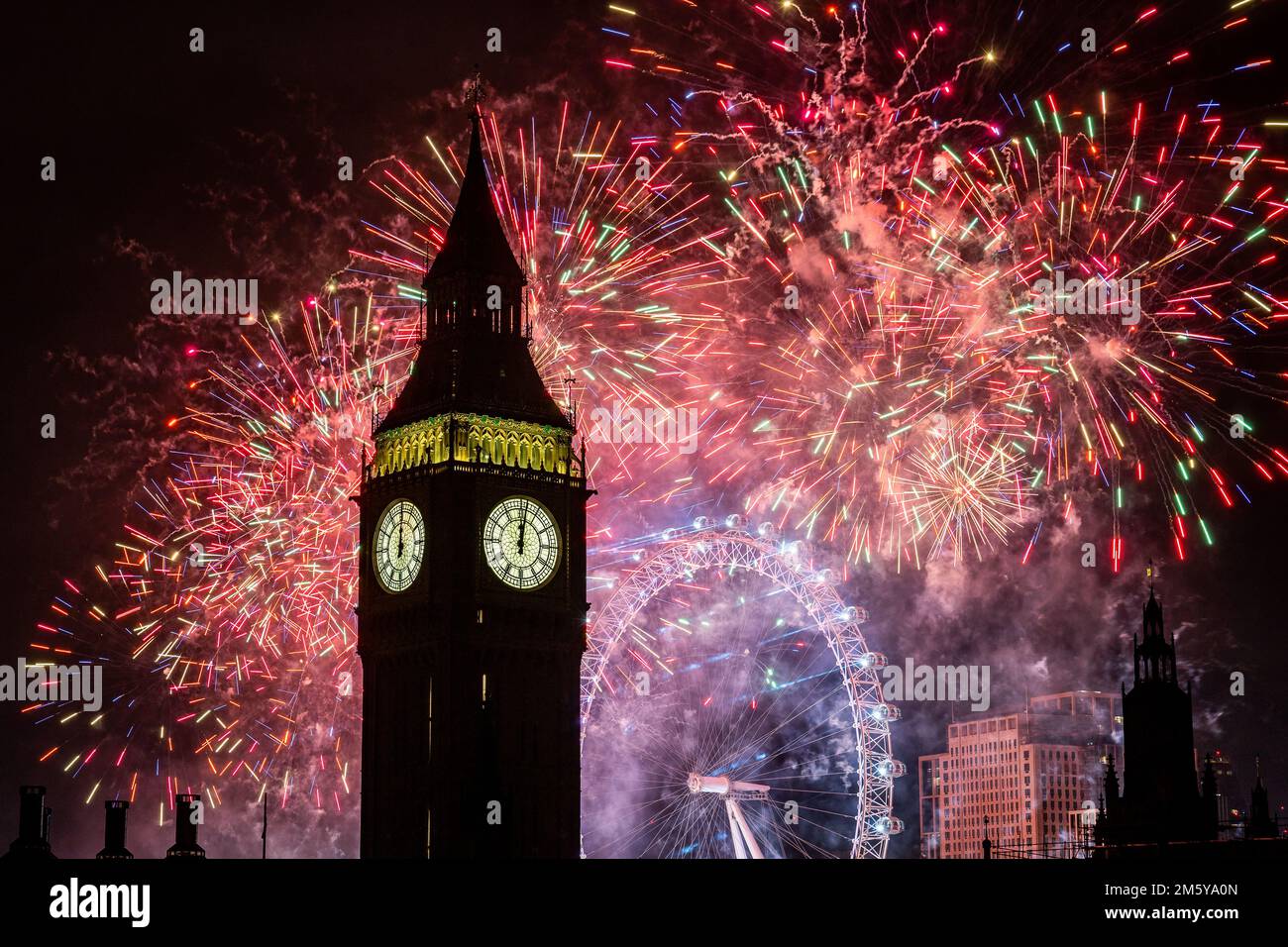 Fireworks light up the sky over the London Eye and the Elizabeth Tower ...