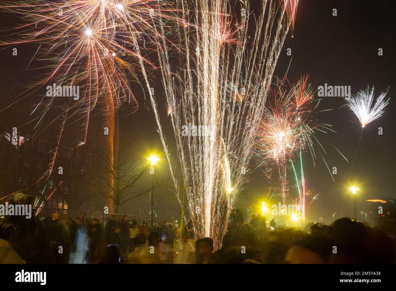 Cologne, Germany. 01st Jan, 2023. Fireworks rise into the night sky at ...