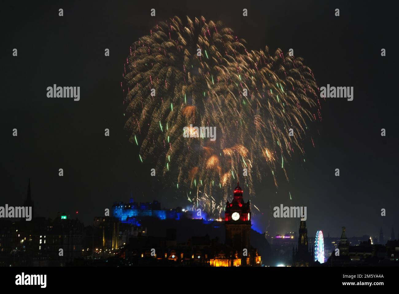 Fireworks explode over Edinburgh Castle during the street party for Hogmanay New Year ...