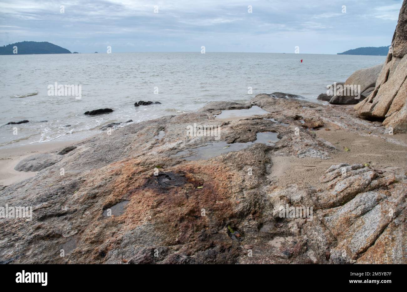 huge boulders laying beside the beach Stock Photo - Alamy