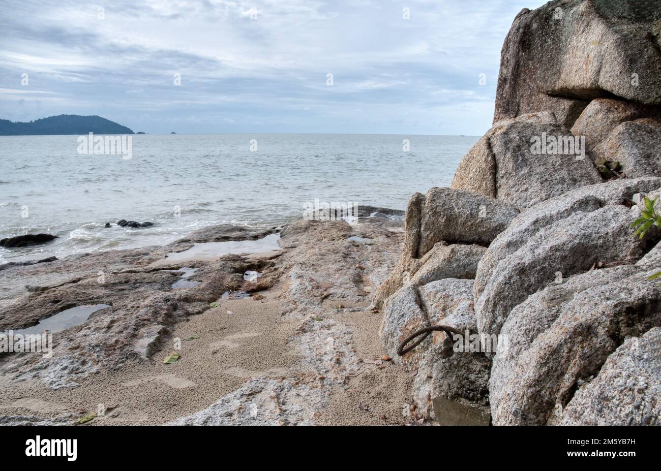 huge boulders laying beside the beach Stock Photo - Alamy