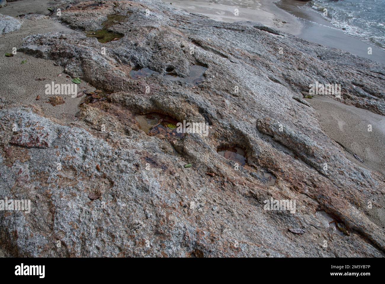 huge boulders laying beside the beach Stock Photo - Alamy