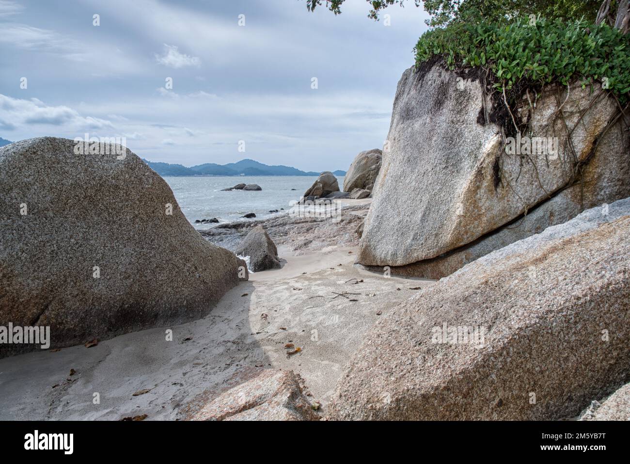 huge boulders laying beside the beach Stock Photo - Alamy