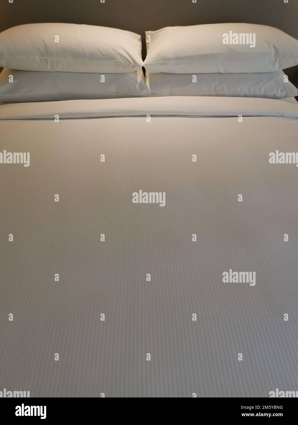 white-colored cozy and comfortable single queen size bed Stock Photo ...