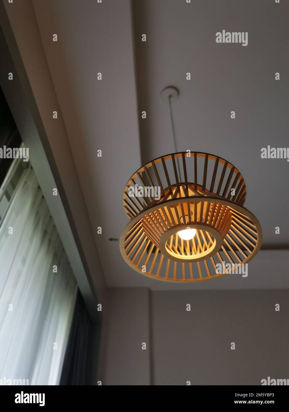 indoor wooden ceiling lamp shade Stock Photo - Alamy