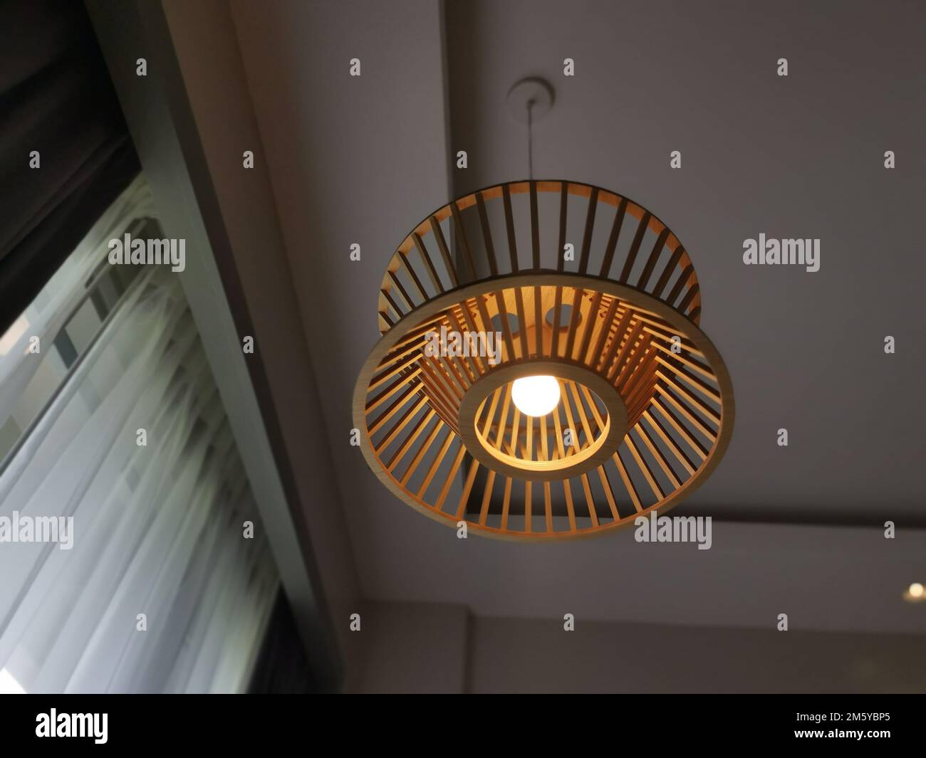 indoor wooden ceiling lamp shade Stock Photo - Alamy