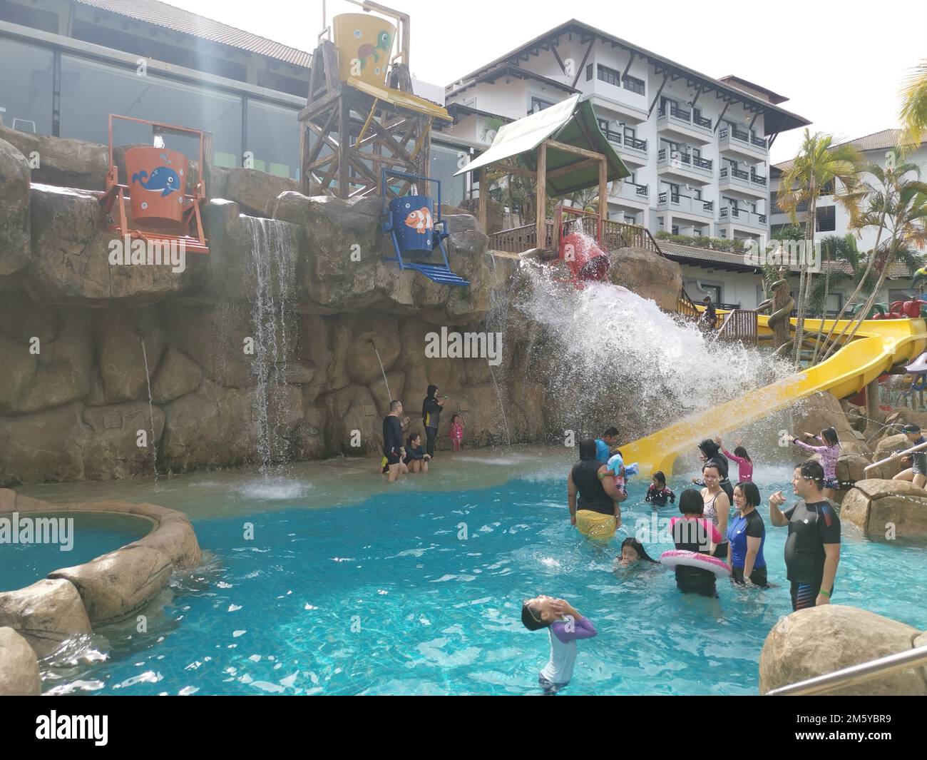 Perak, Malaysia. December 25,2022: Children and adult tourists enjoying ...