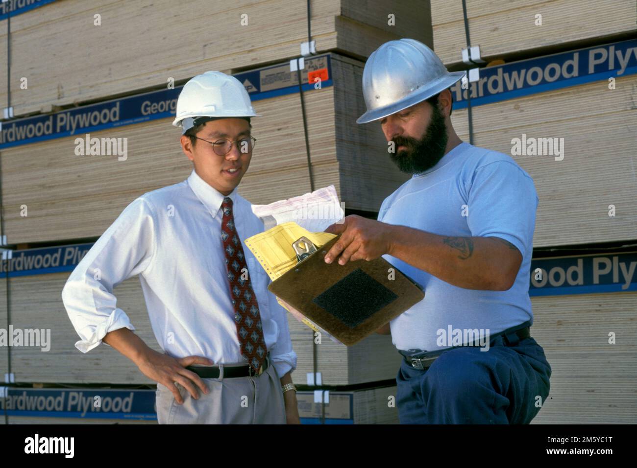 Lumber warehouse men MR Stock Photo - Alamy