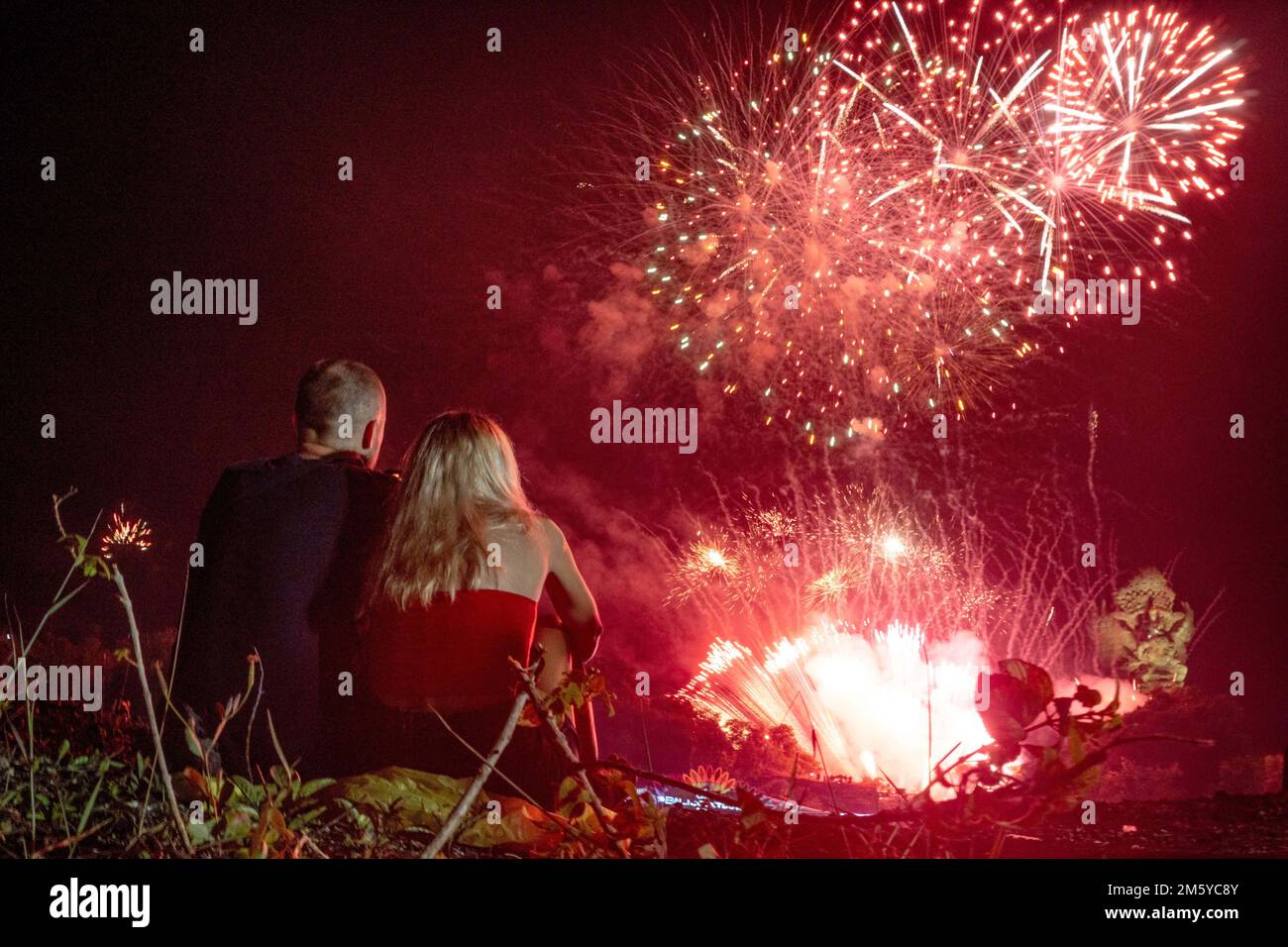 Bali, Indonesia. 31st Dec, 2022. People watch fireworks during New Year ...