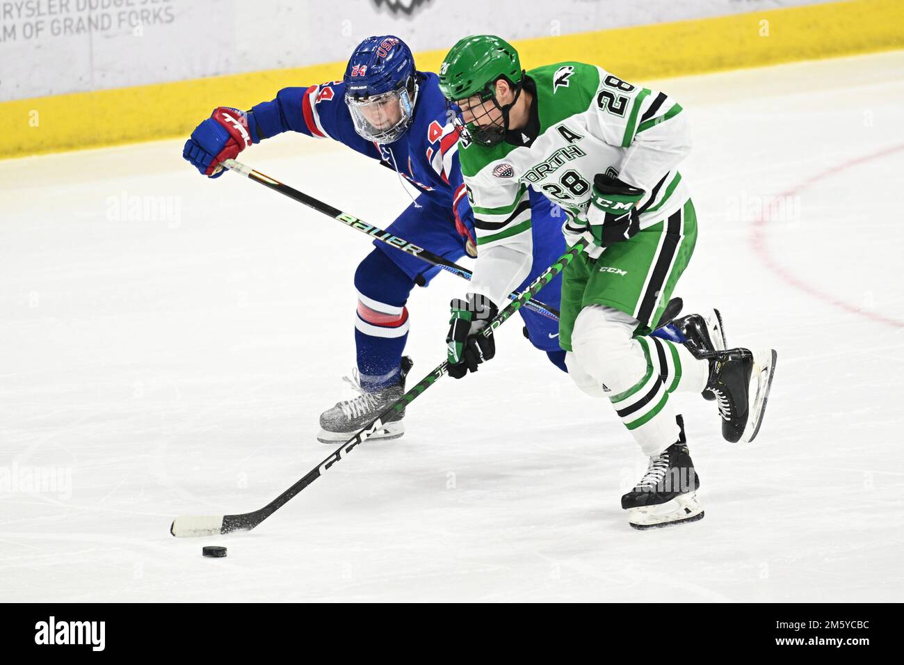 US National U-18 team forward Drew Fortescue (24) attempts to slow down ...