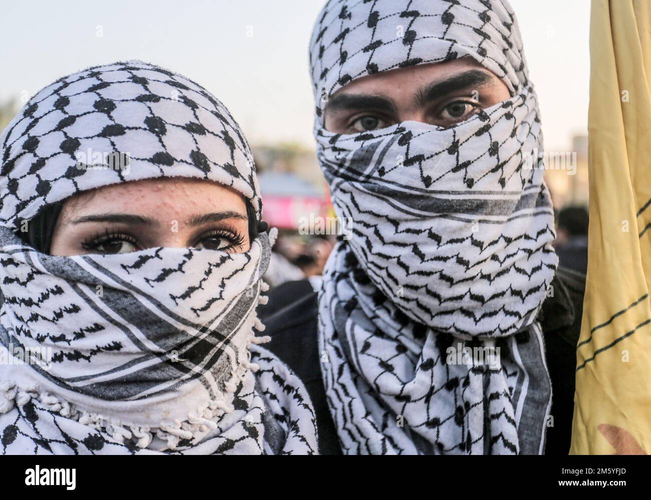 Palestinians wearing keffiyeh during the rally to commemorate the 58th ...