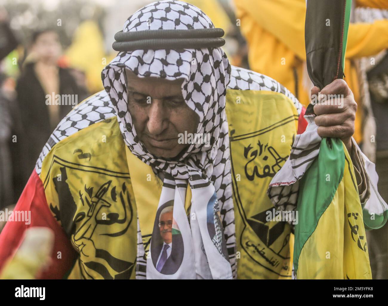 An elderly supporter of the Palestinian Fatah movement attends the ...