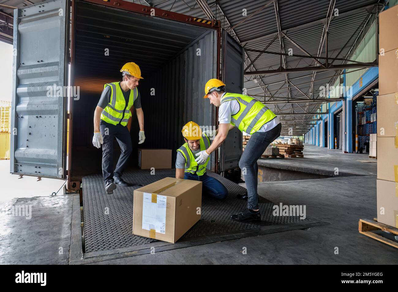 Worker carry carton box taken from 40 feet steel container got accident ...