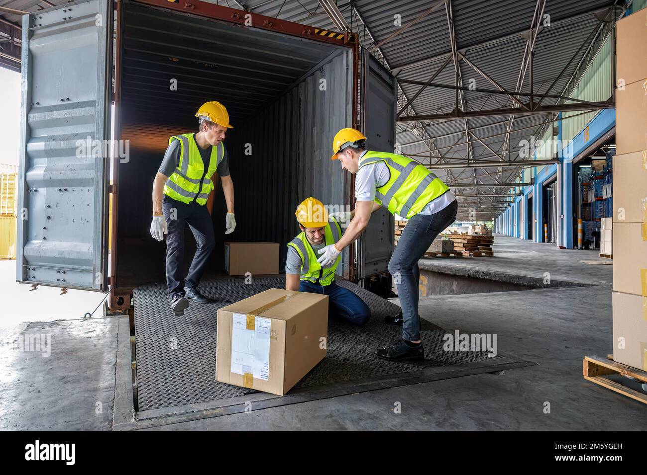 Worker carry carton box taken from 40 feet steel container got accident ...