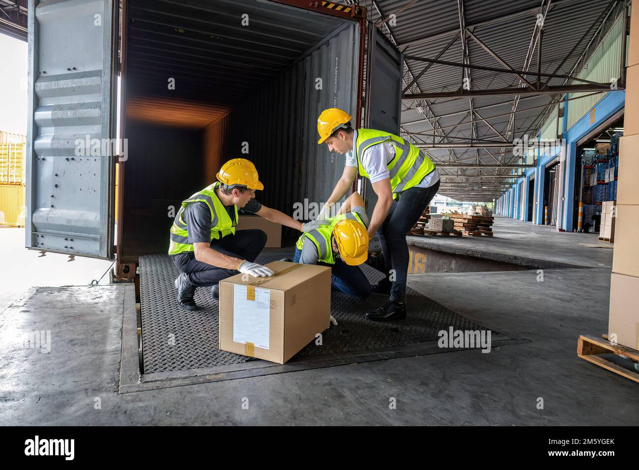Worker carry carton box taken from 40 feet steel container got accident ...