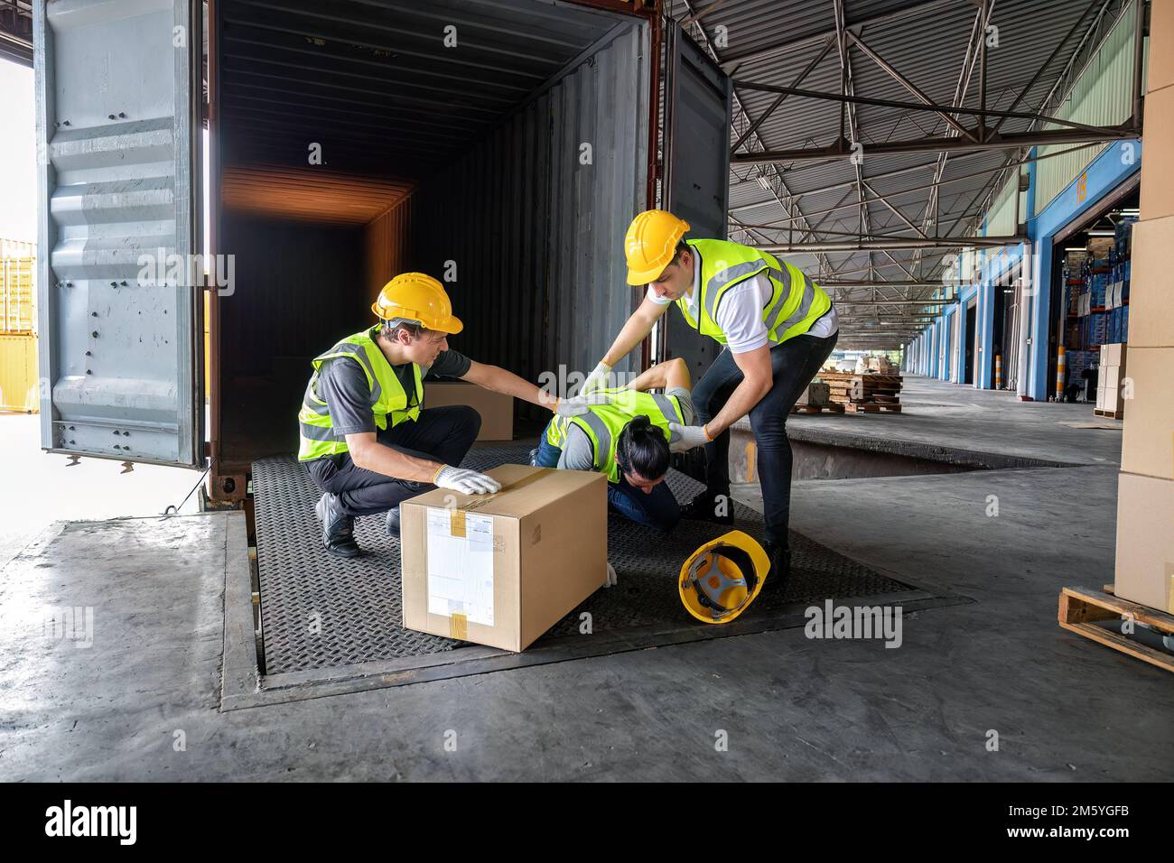 Worker carry carton box taken from 40 feet steel container got accident ...