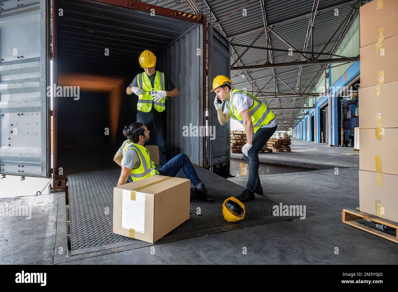 Worker carry carton box taken from 40 feet steel container got accident ...