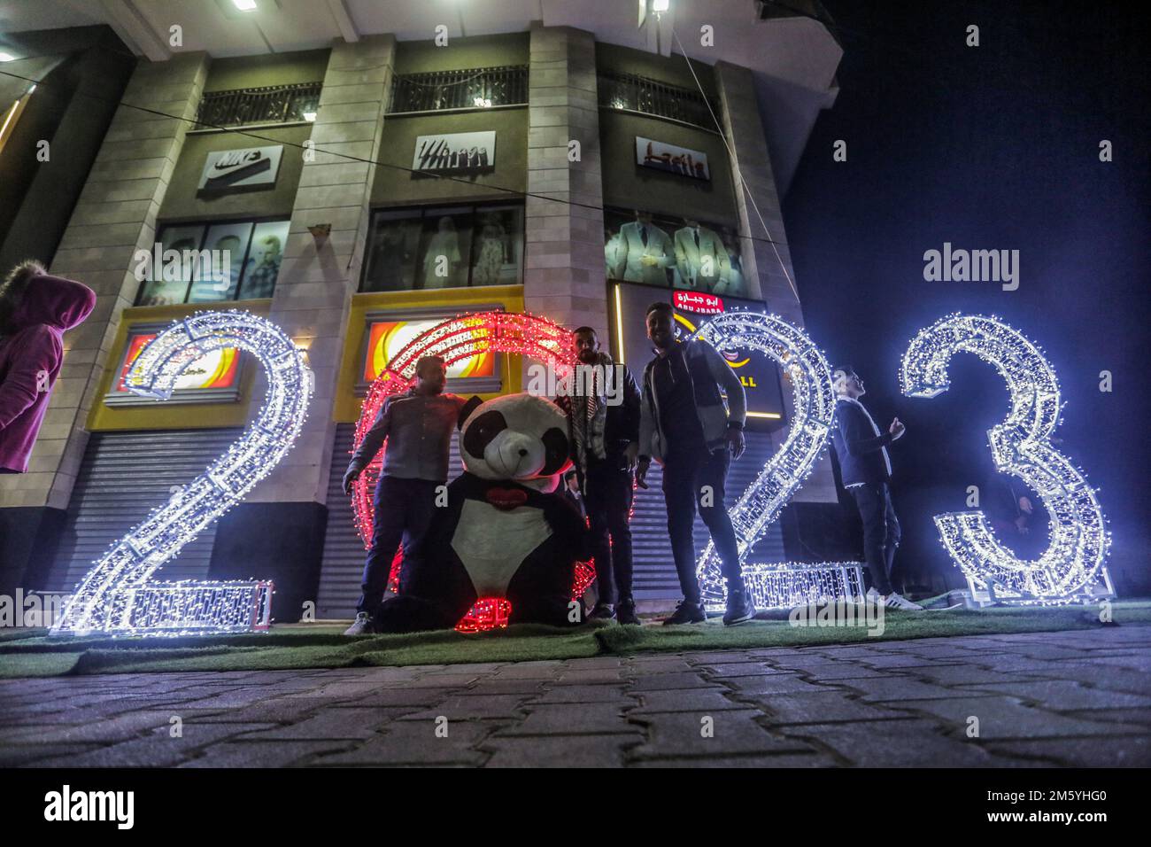 Gaza, Palestine. 31st Dec, 2022. Palestinian youths stand in front of ...