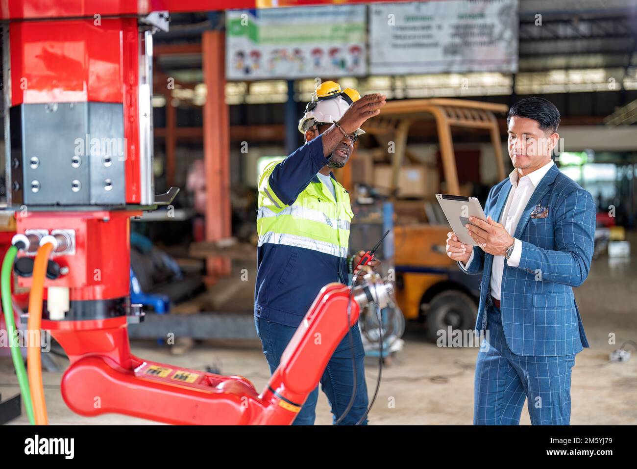 Engineer customer service explain introduction of new design robotic ...