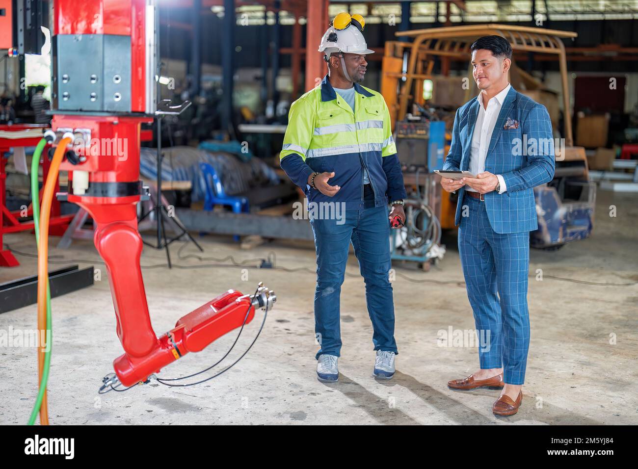 Engineer customer service explain introduction of new design robotic ...