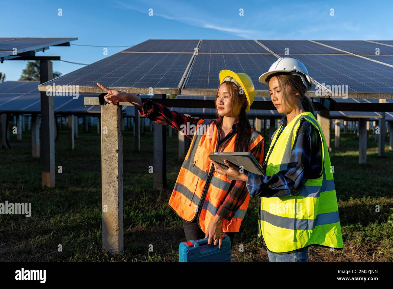 2 maintenance girl engineer carry tool box routine maintenance at ...