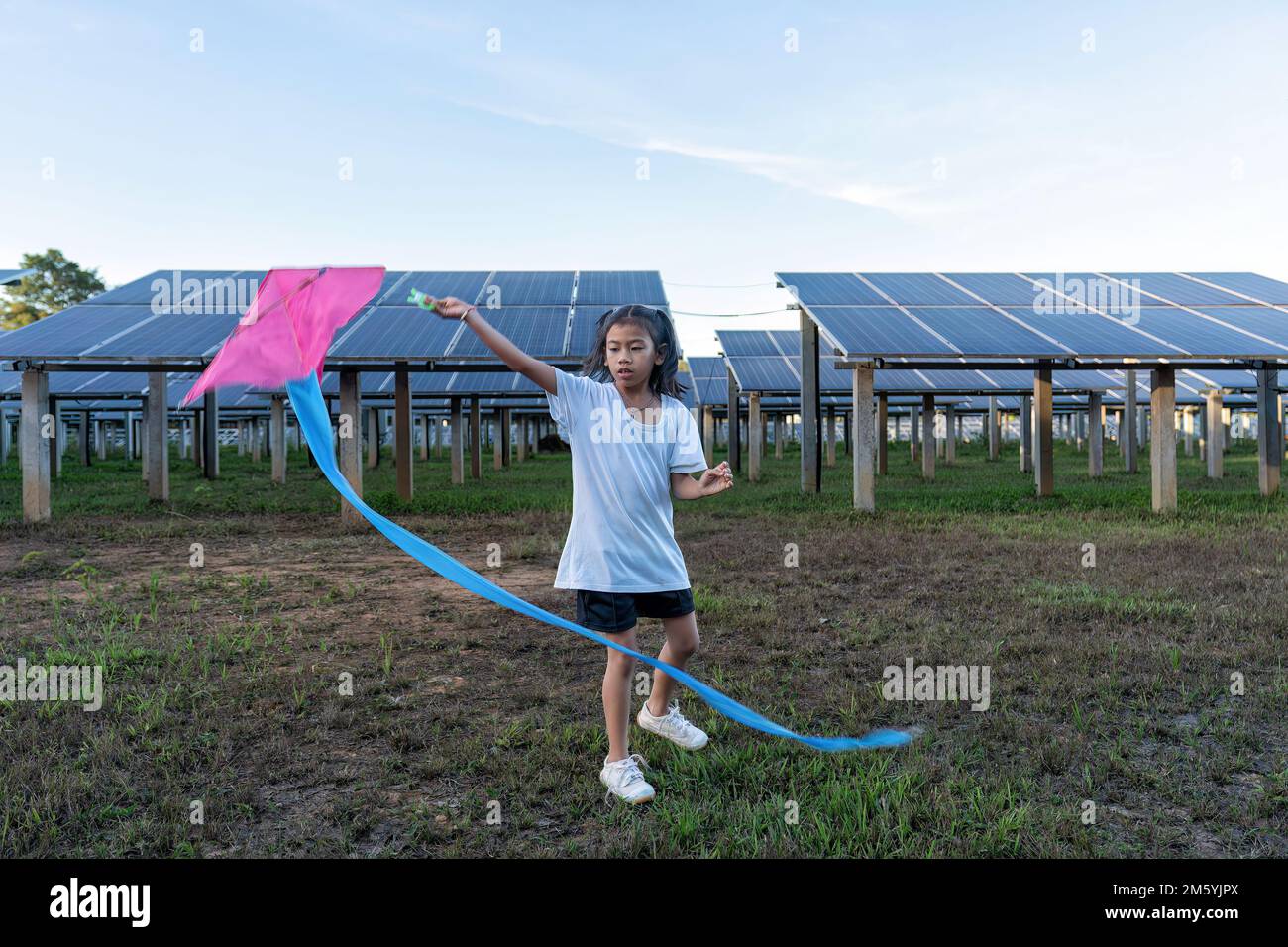 Solar farm on greenery tree in the village provide clean energy eco ...
