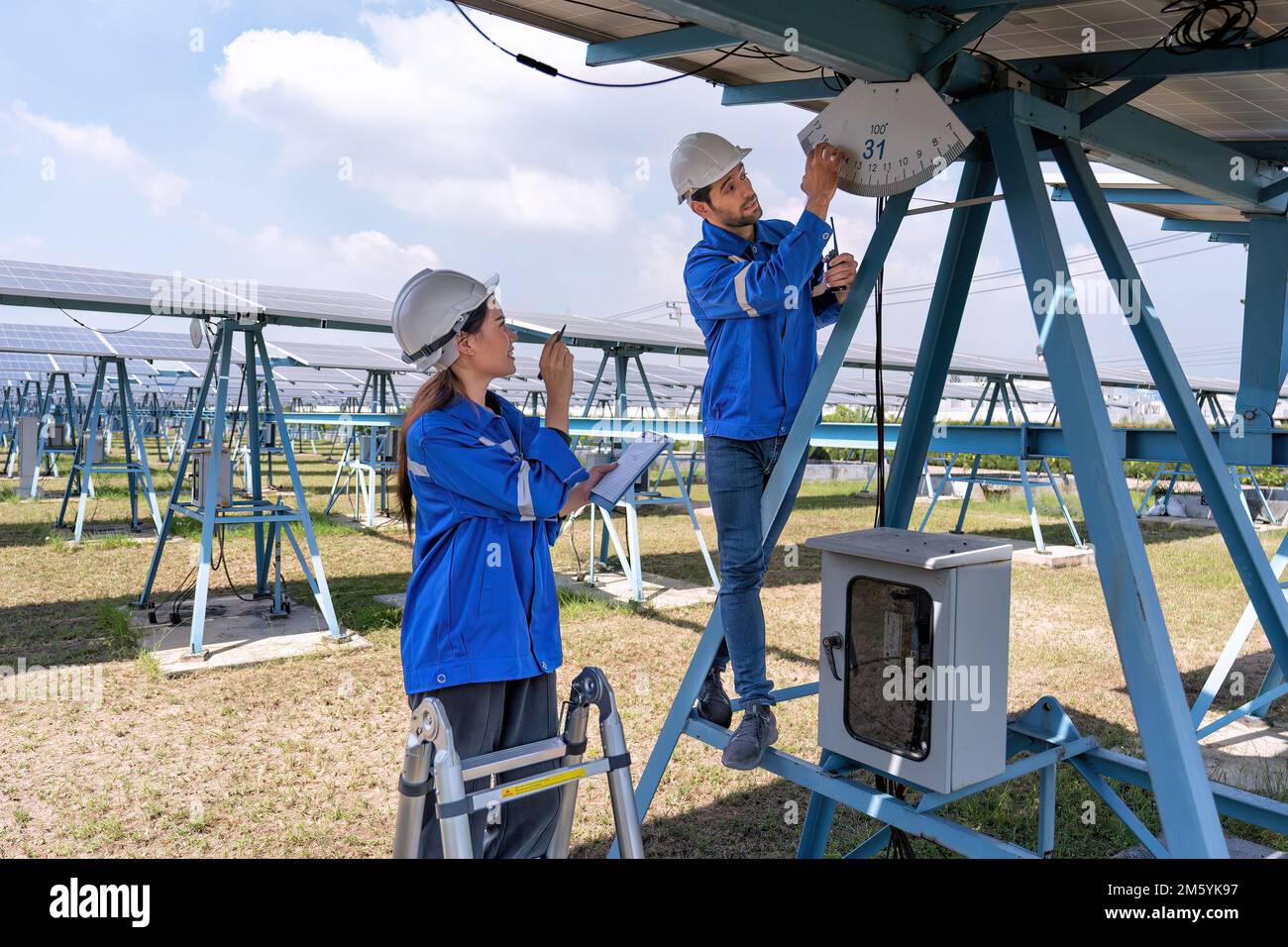 Maintenance engineer at solar farm stand on structure support checking ... Maintenance engineer at solar farm stand on structure support checking ...