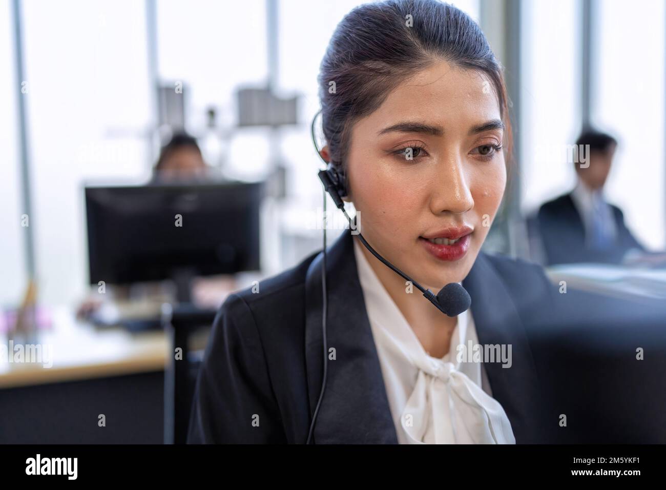 Happy business people using headsets hi-res stock photography and ...