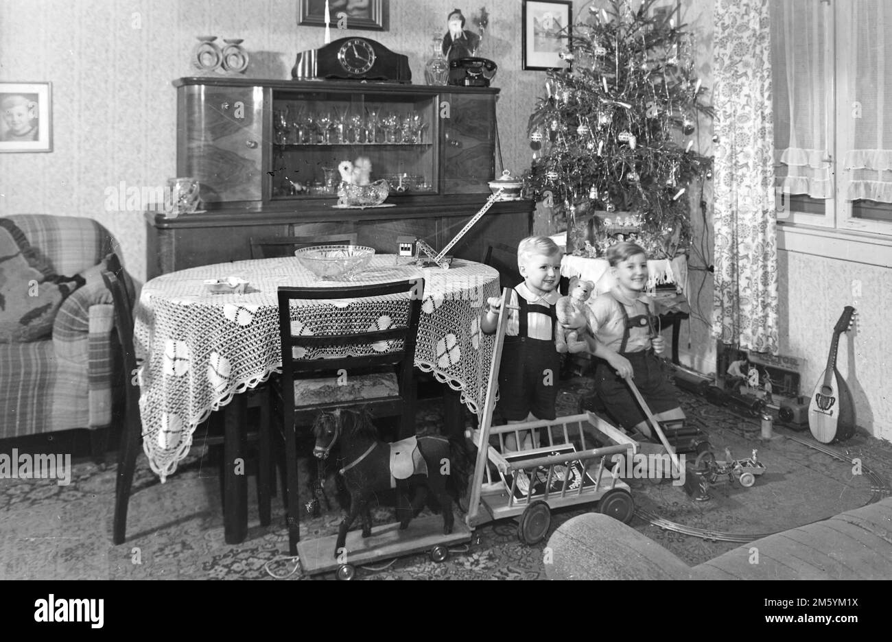 Two young German boys celebrate Christmas, ca. 1949 Stock Photo - Alamy