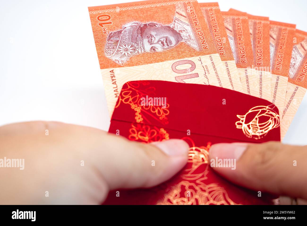 Chinese new year festival red envelope with Ringgit Malaysia note on ...