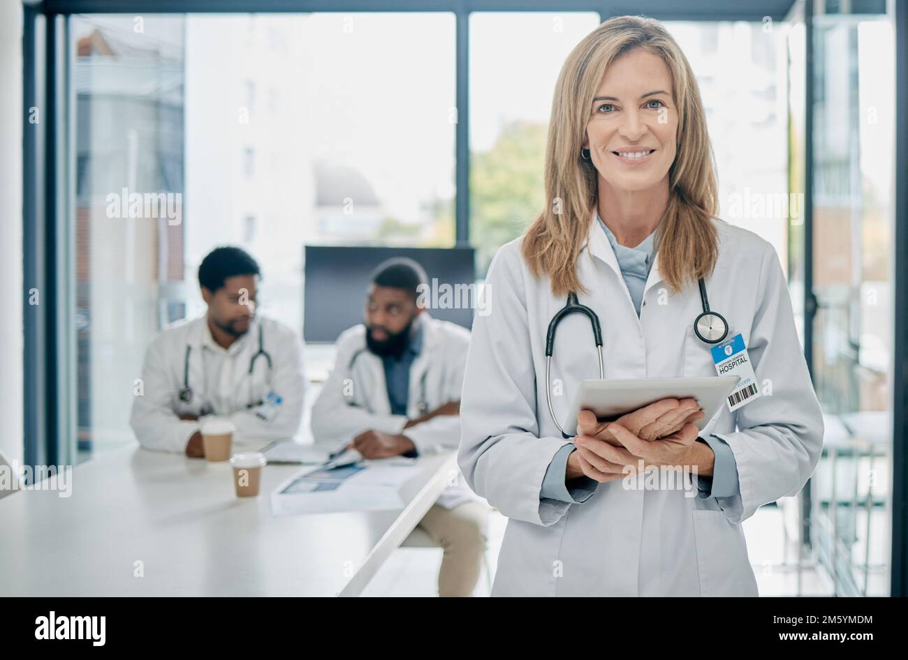 Doctor, tablet and senior woman, leadership and health with medical ...