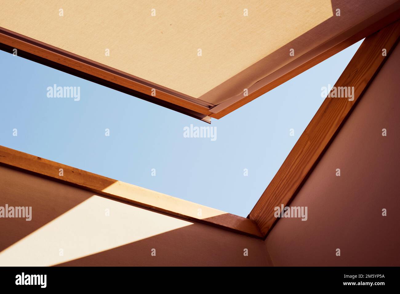 Open skylight with a piece of blue sky Stock Photo - Alamy