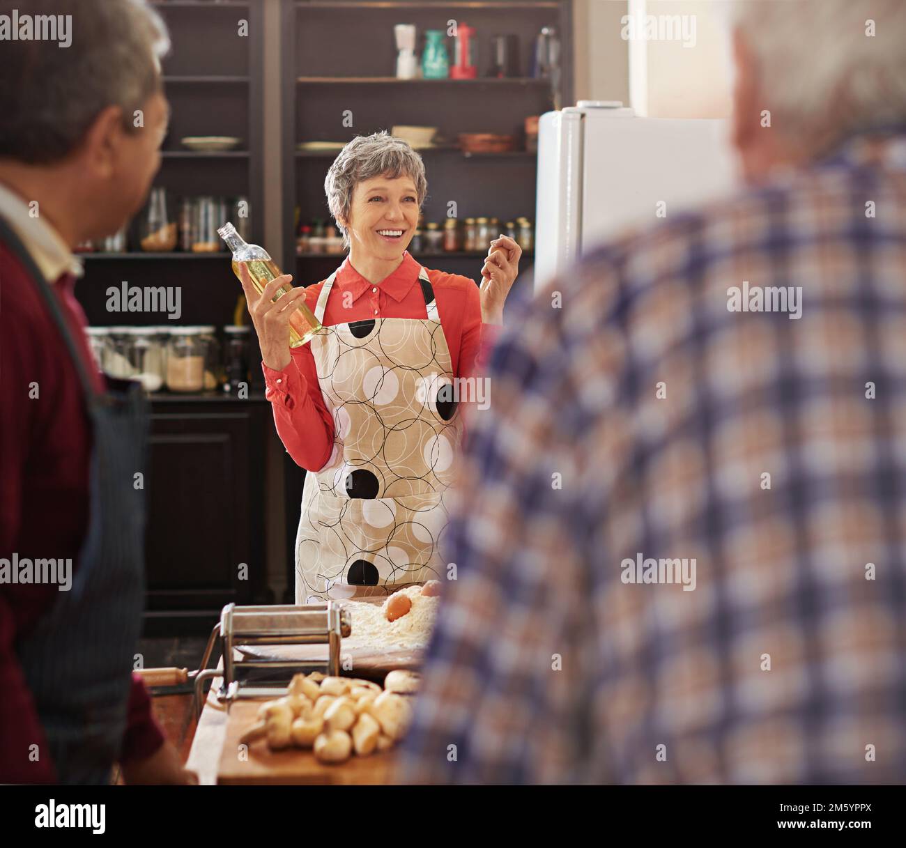 Lets get cooking. a woman instructing a cooking class Stock Photo - Alamy