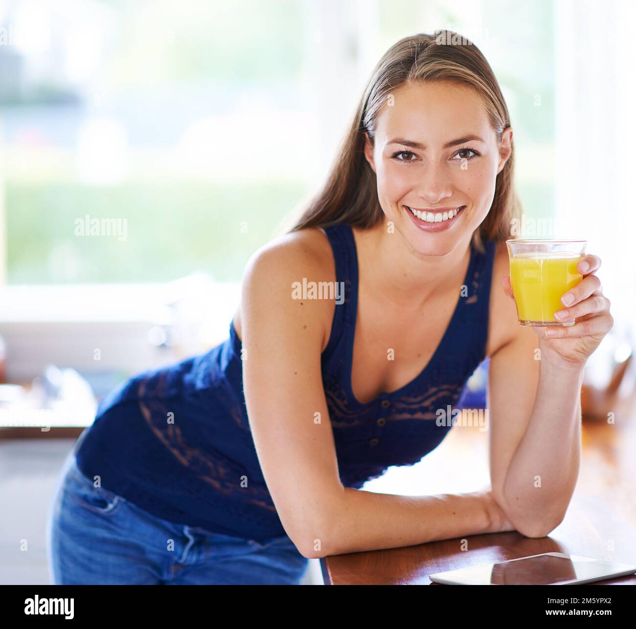 Young woman orange juice hi-res stock photography and images - Alamy
