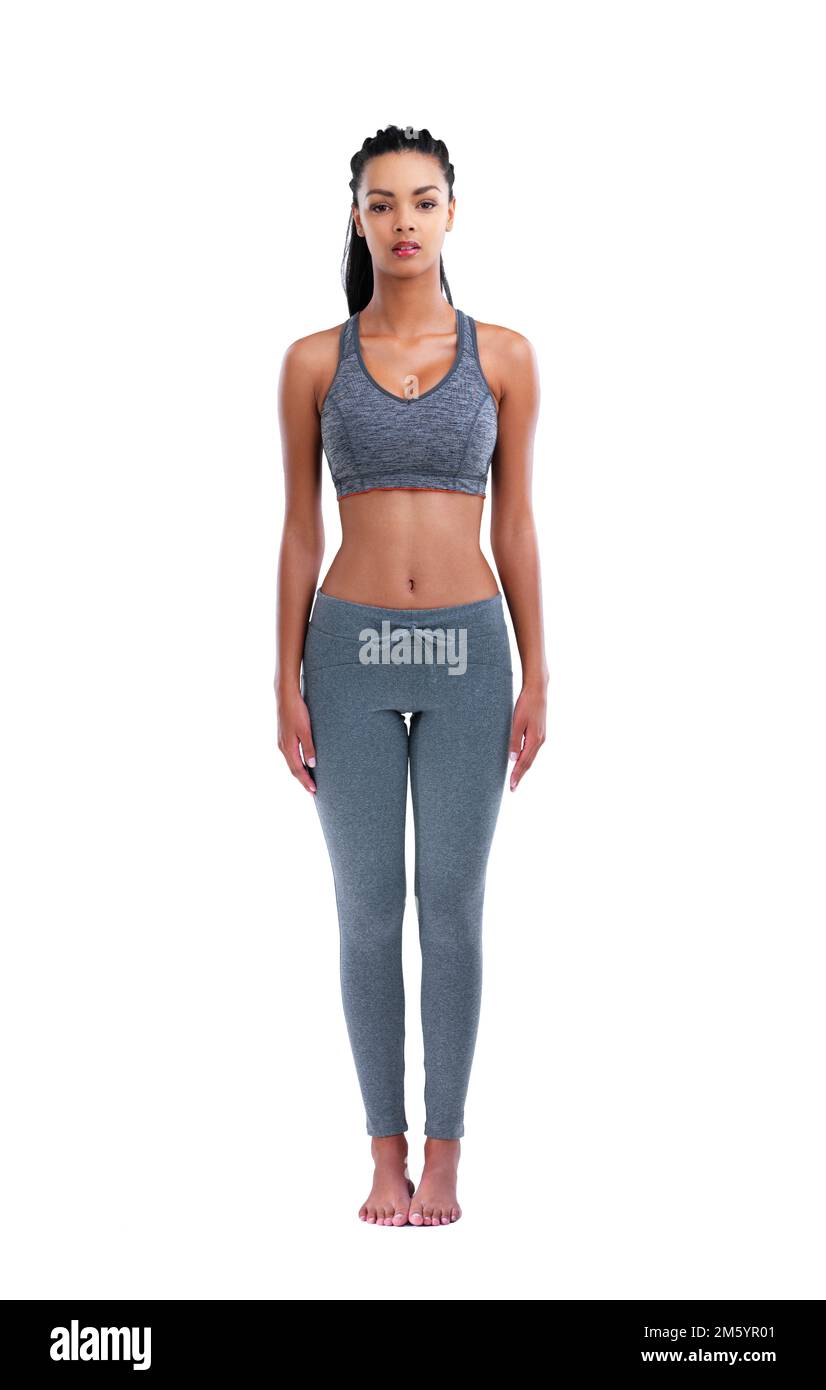 Shes dressed for the part. Full length portrait of a female athlete isolated on white Stock ...