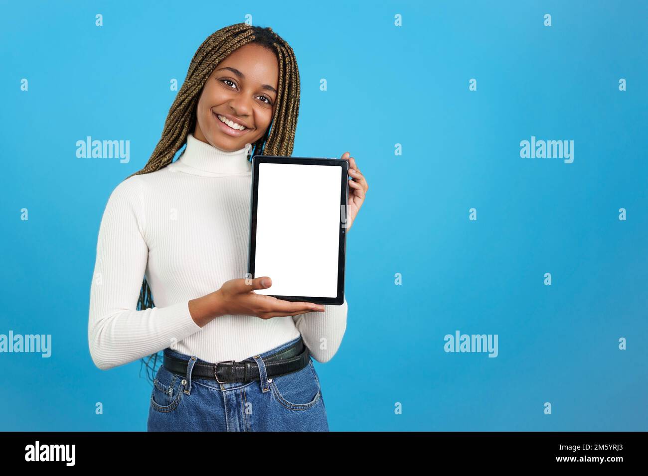 Smiling african woman showing the screen of a digital tablet Stock ...