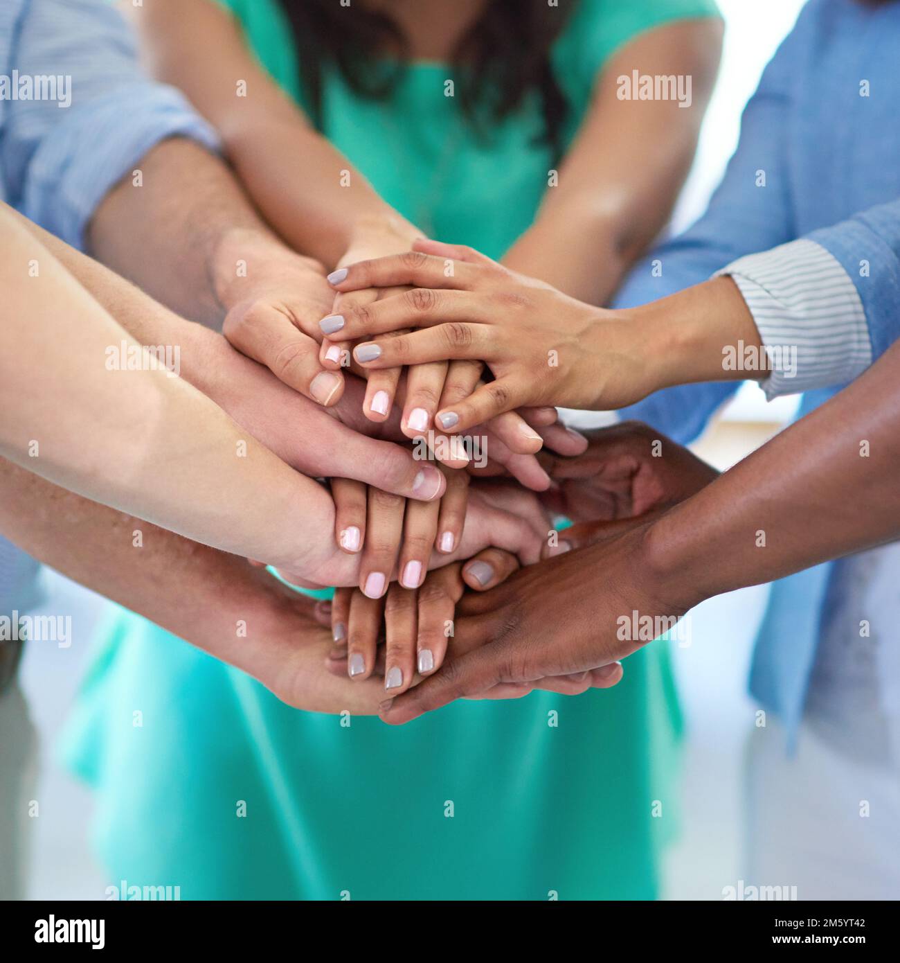 United in creativity. a creative business team in a huddle Stock Photo ...