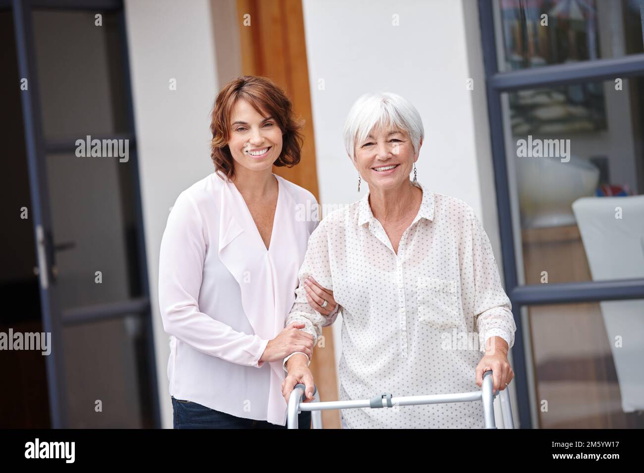 I have all the help I need. a woman assisting her elderly mother whos ...