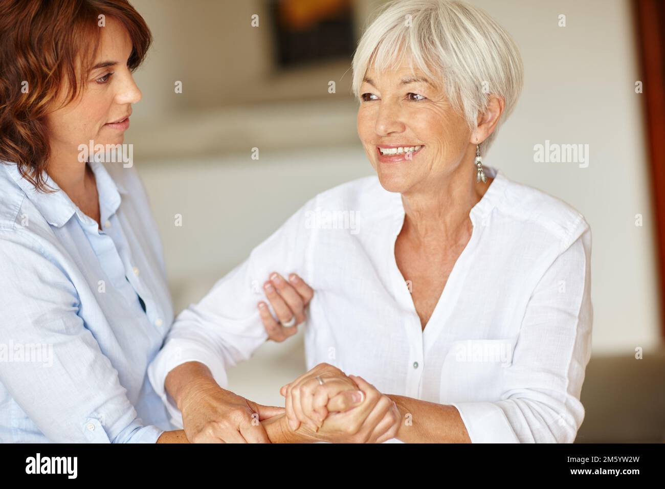 Its time for me to look after you. a woman assisting her elderly mother ...
