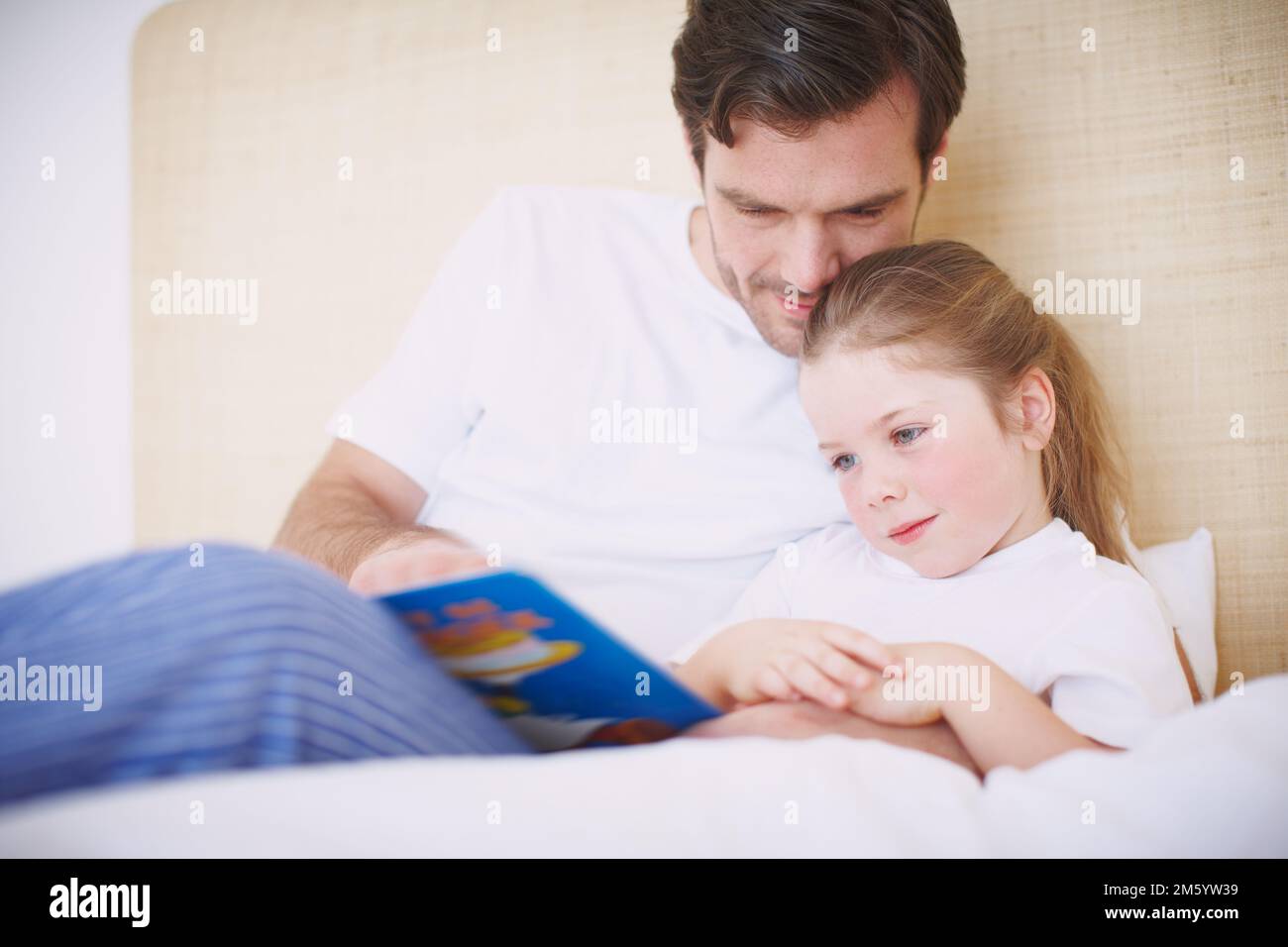She knows how this one ends...A devoted father reading his young ...