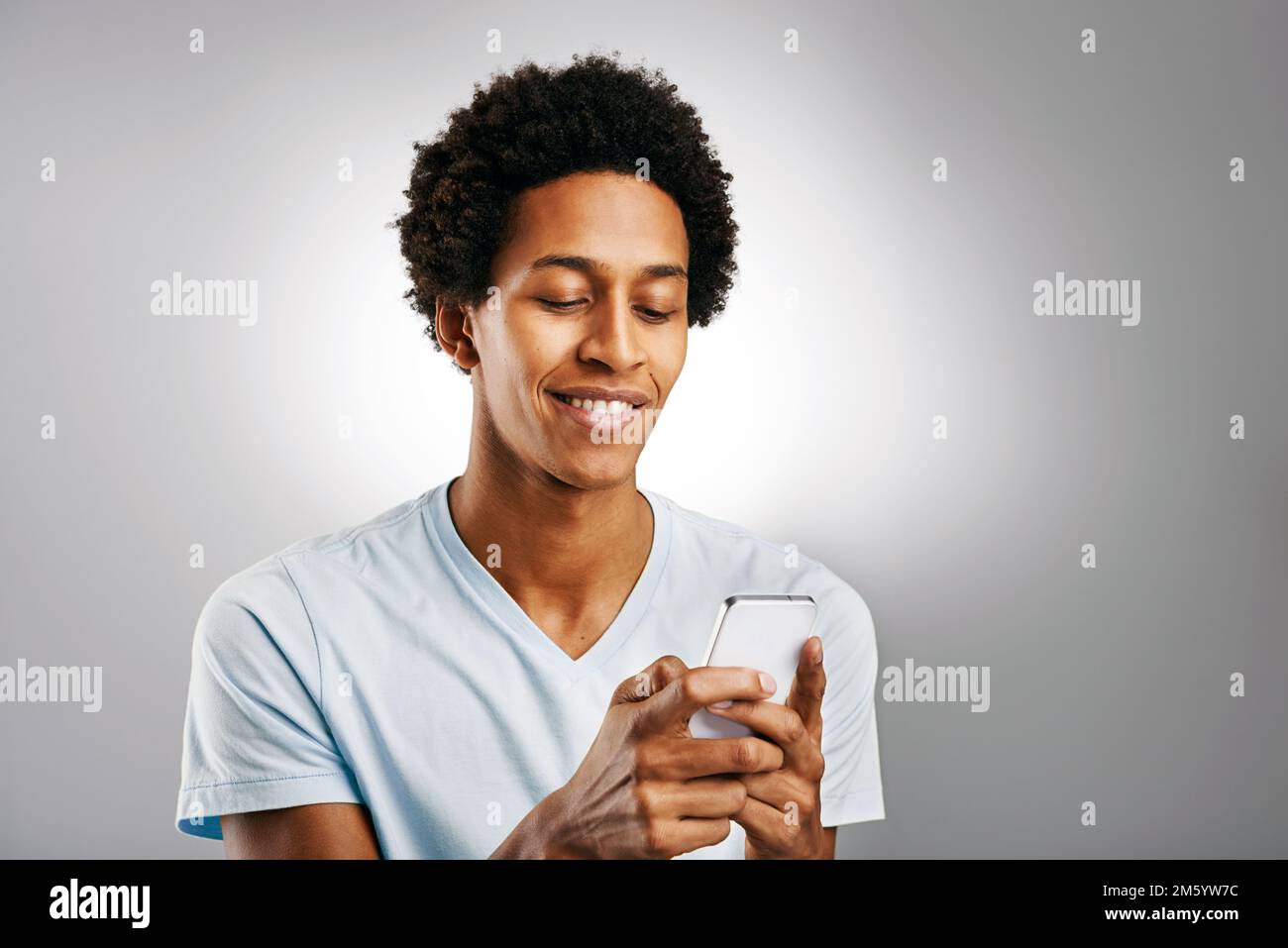 Now the world really is at your fingertips. a young man using his ...
