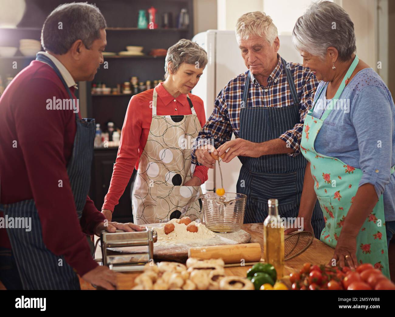 The beginning of something delicious. a group of seniors cooking in the ...