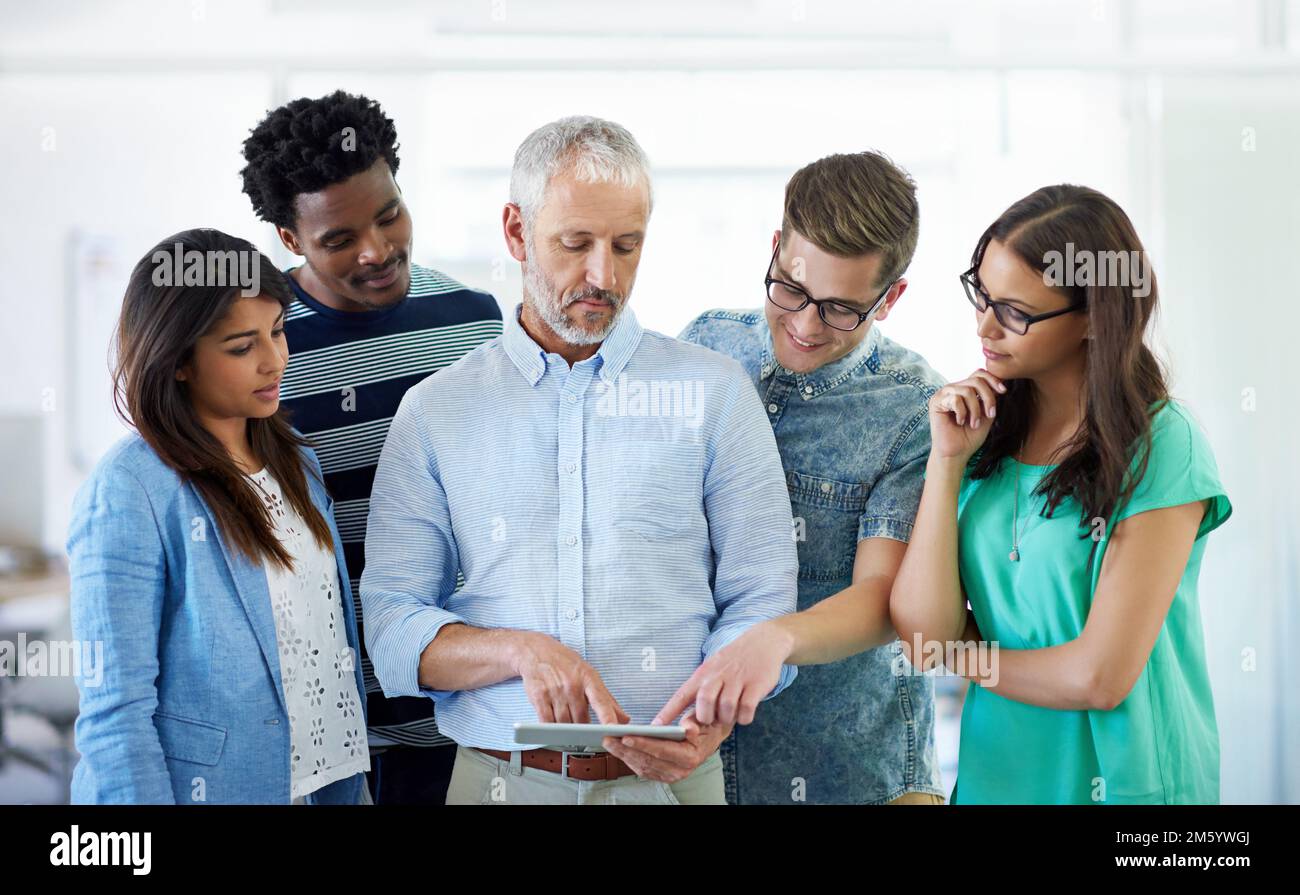 Dynamic and dedicated. a group of creative businesspeople looking at a ...
