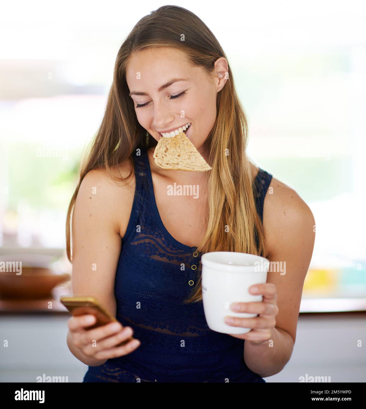 All happiness depends on a leisurely breakfast. a woman using her ...