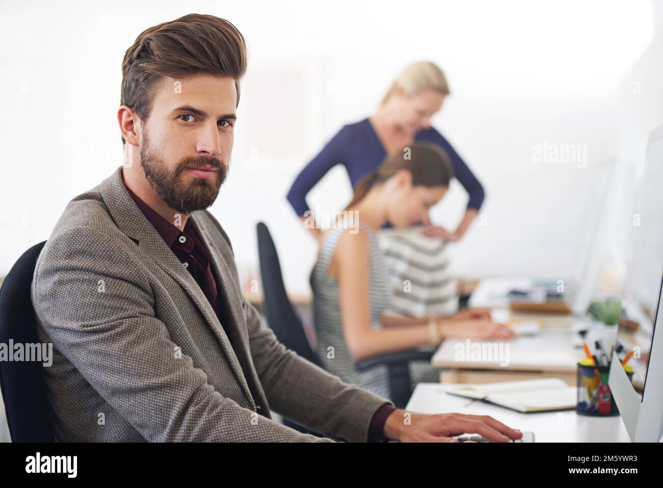 He takes his job seriously. Portrait of a serious businessman sitting ...