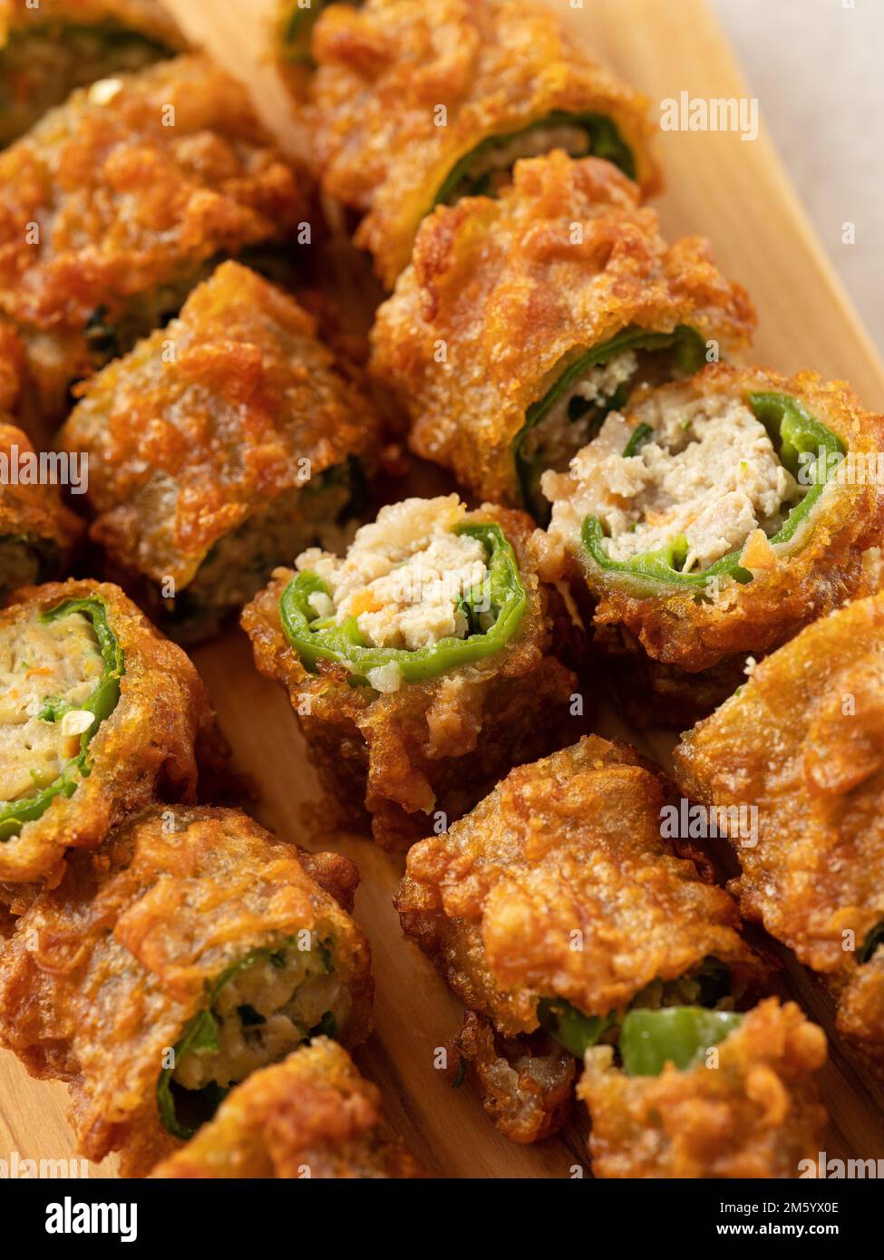 Fried chilli pepper stuffed minced meat and vegetables Stock Photo - Alamy