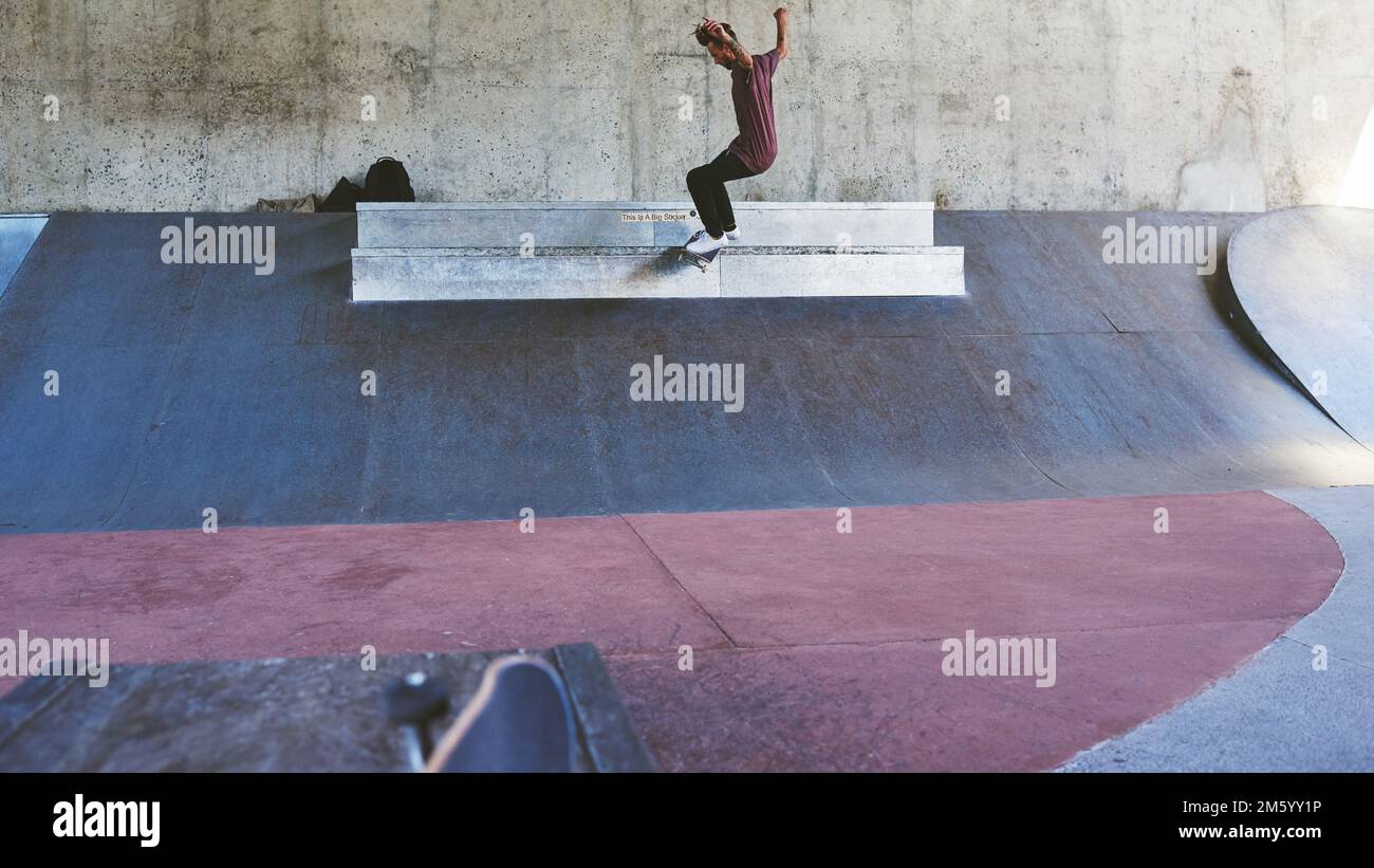 Keep on pushing. a young man doing tricks on his skateboard at the ...