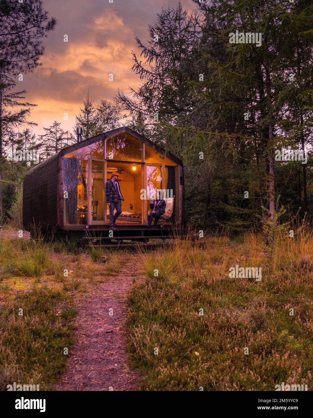 Wooden hut in an autumn forest in the Netherlands, cabin off the grid ...