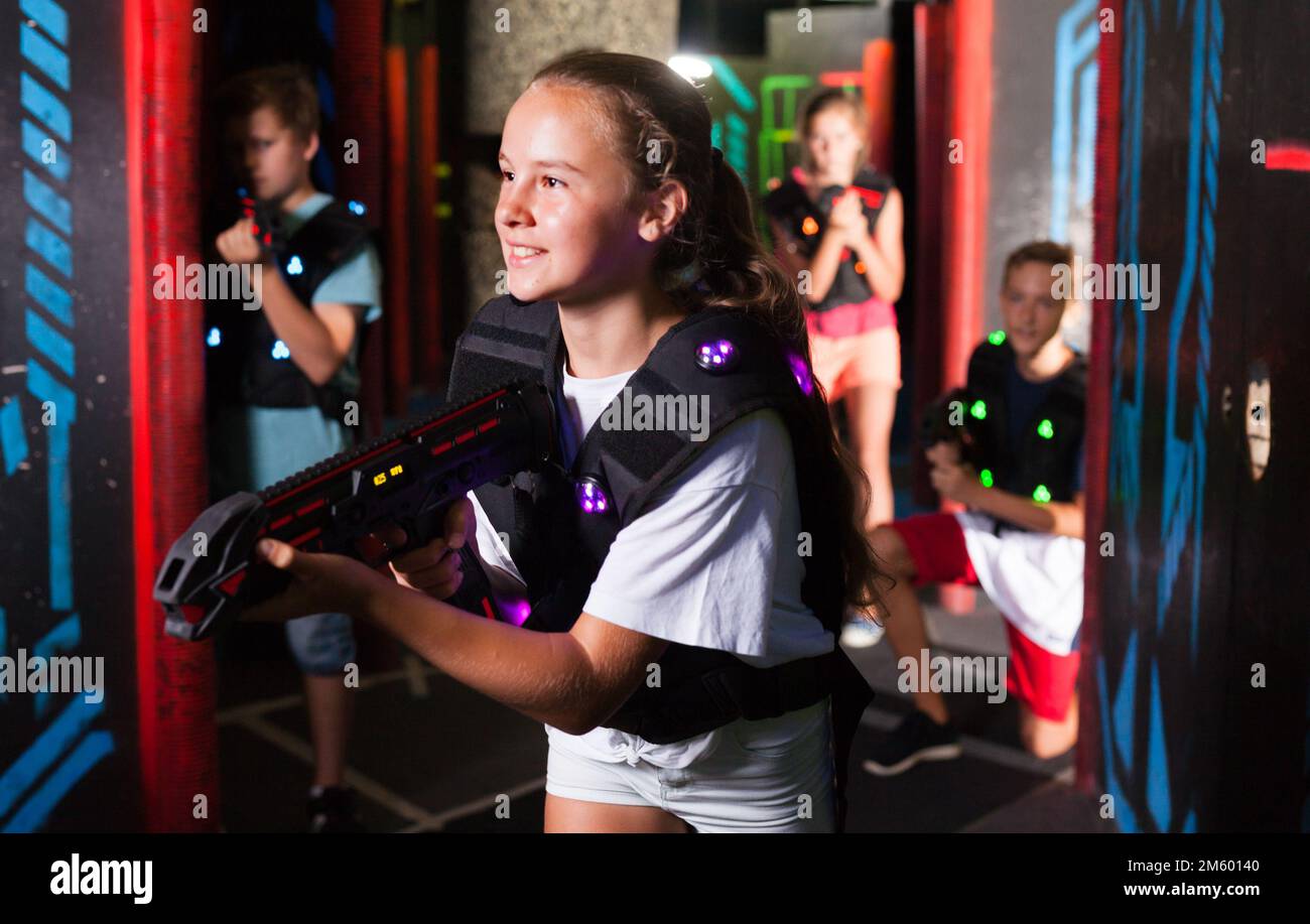 Girl having fun on lasertag arena Stock Photo - Alamy